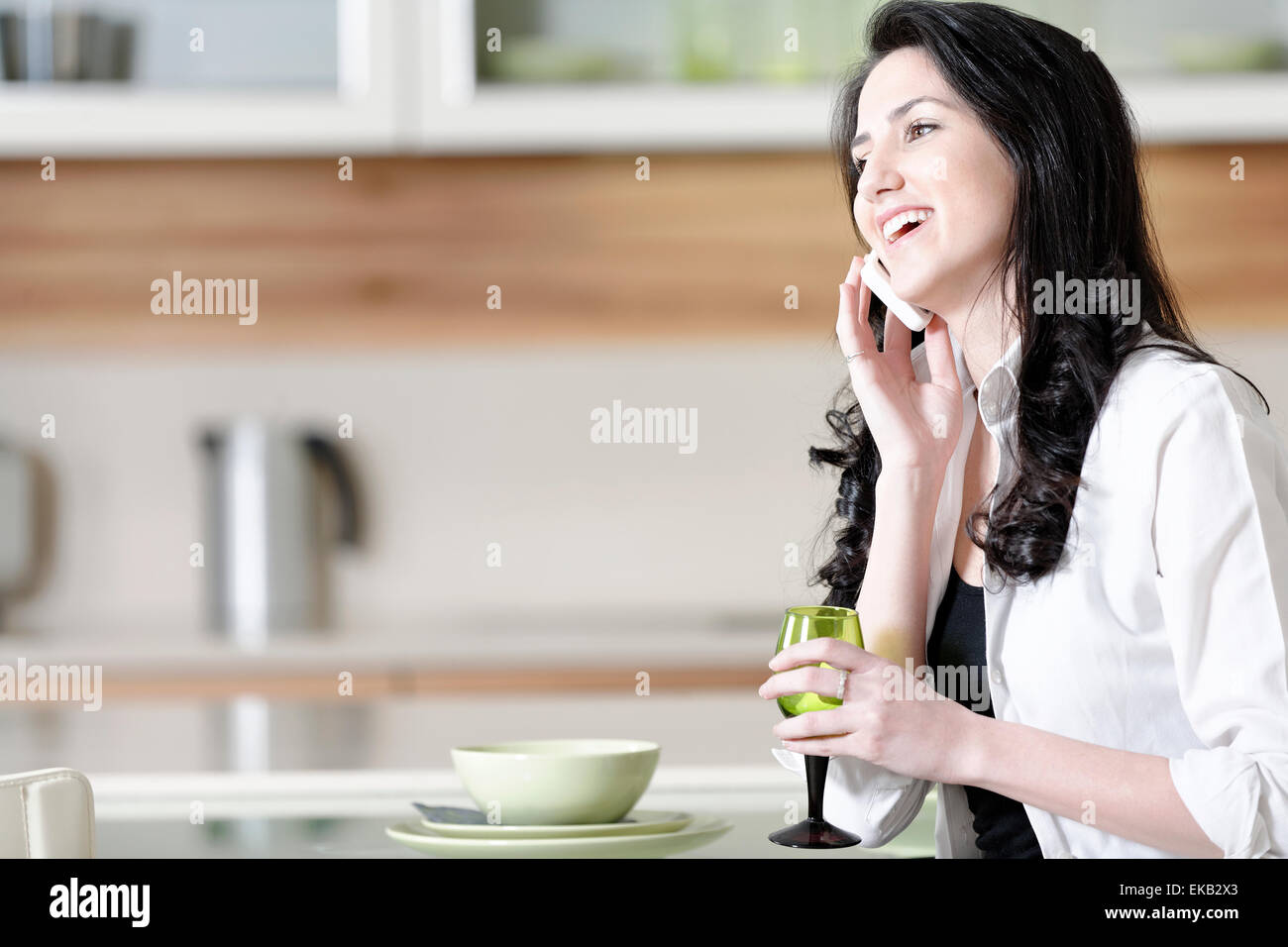 Woman chatting on her mobile phone Stock Photo - Alamy