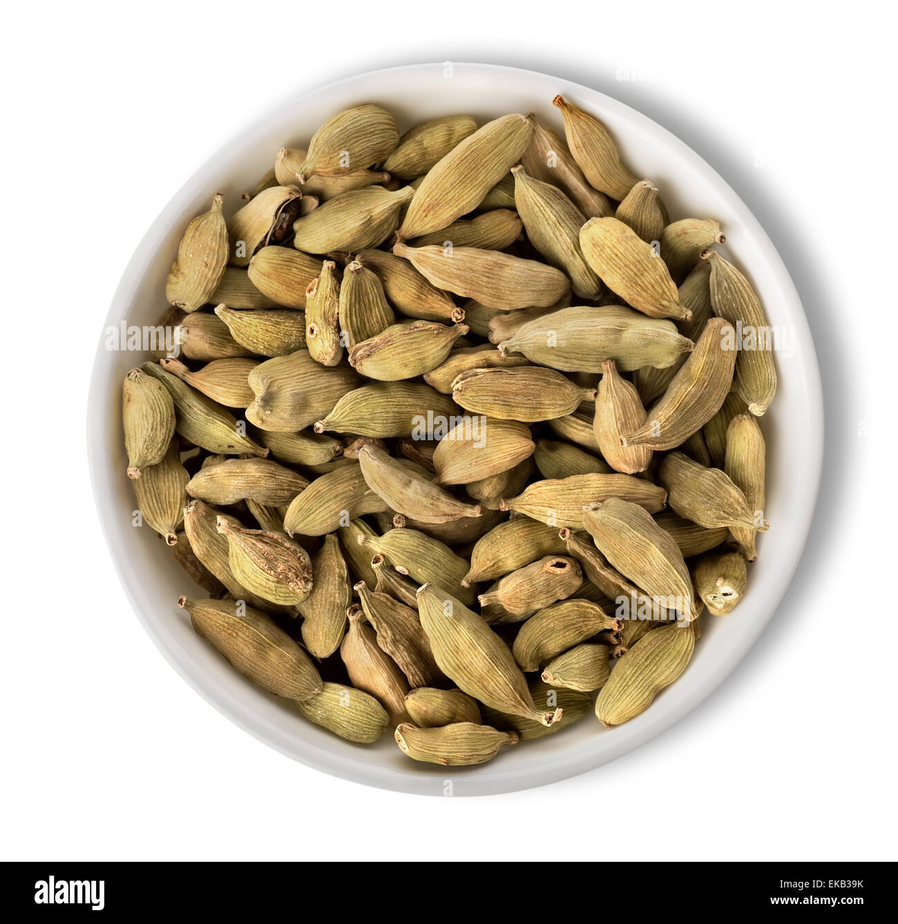 Cardamom in plate isolated Stock Photo - Alamy