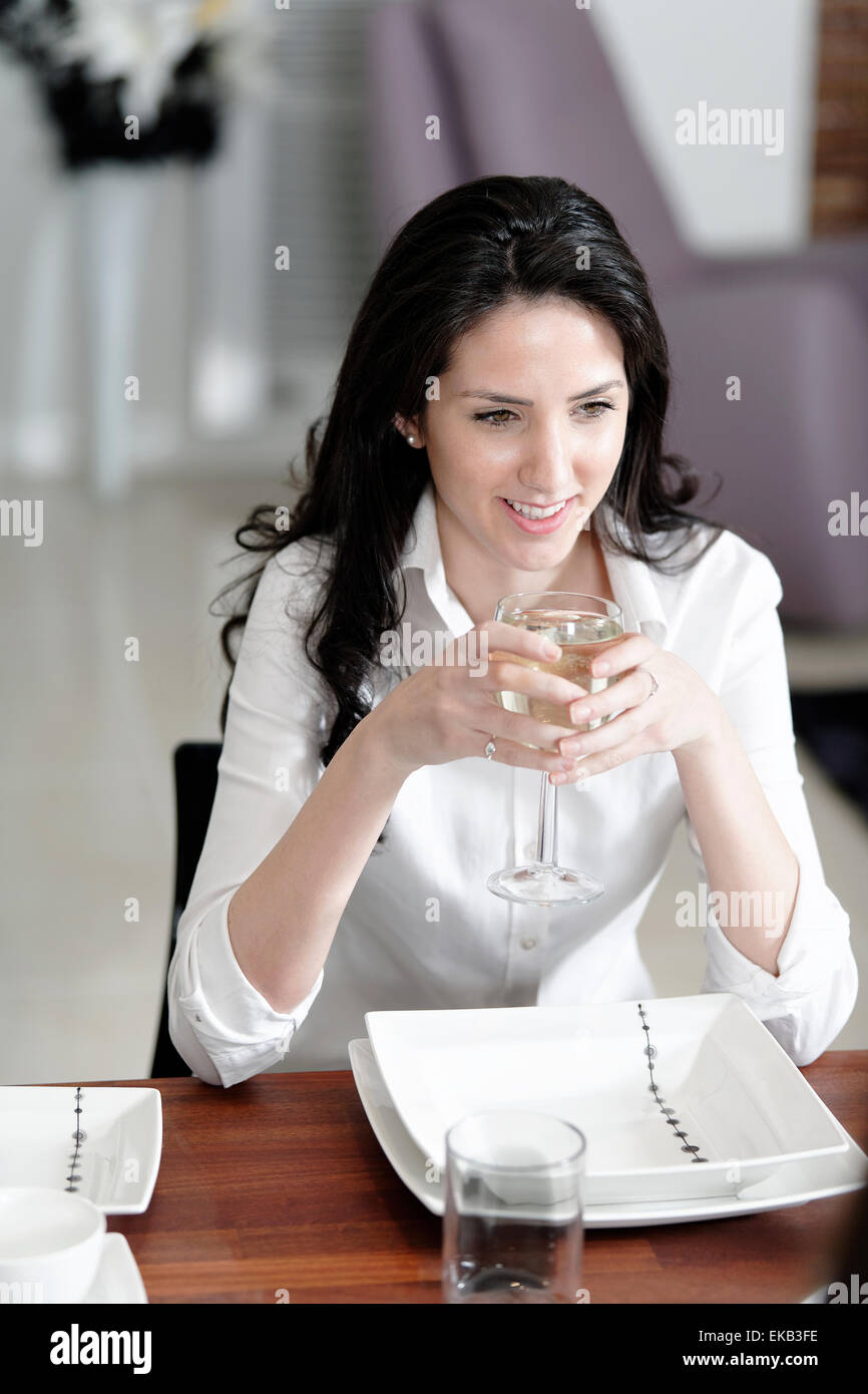 Woman at the dinner table Stock Photo - Alamy