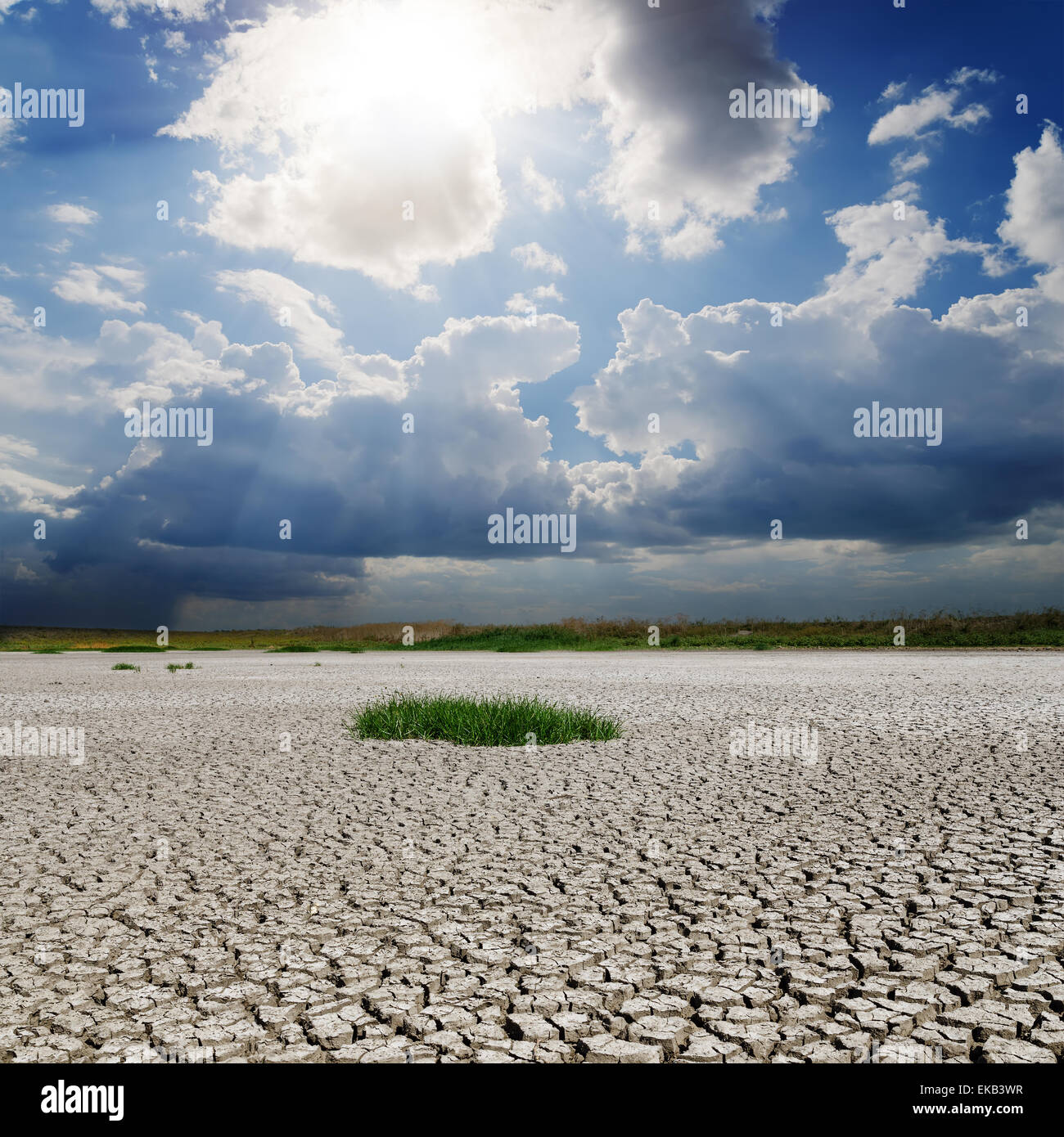 drought earth and sun with clouds Stock Photo - Alamy