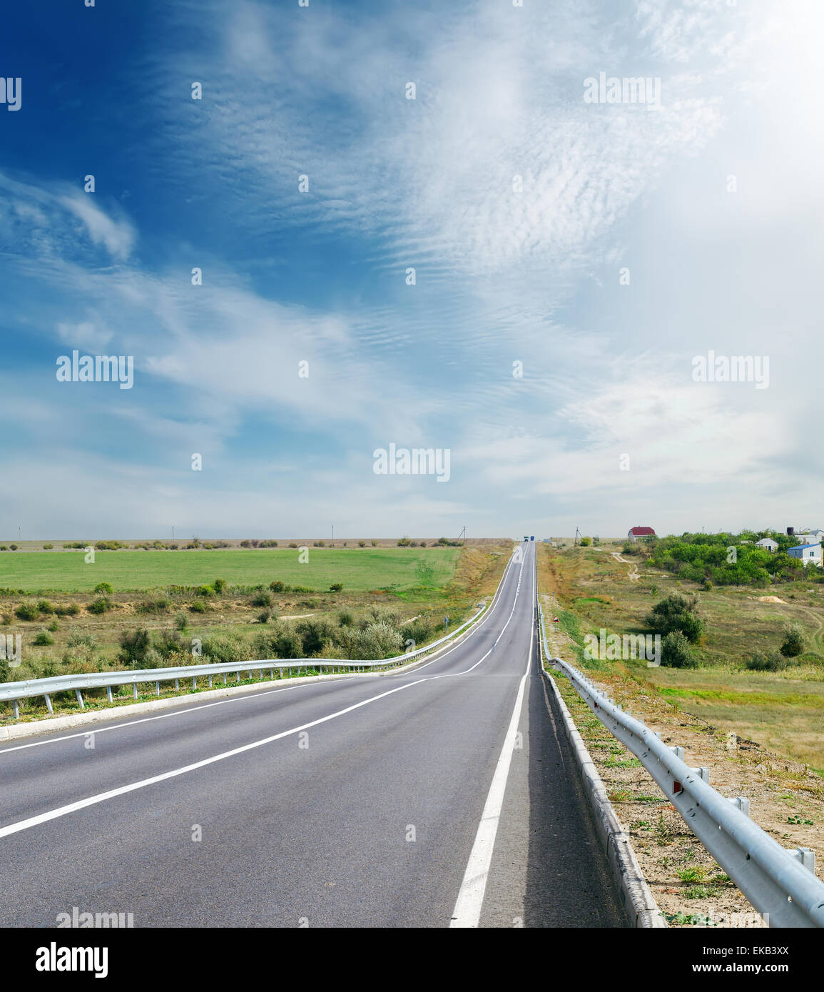 road to horizon and sky with clouds Stock Photo - Alamy