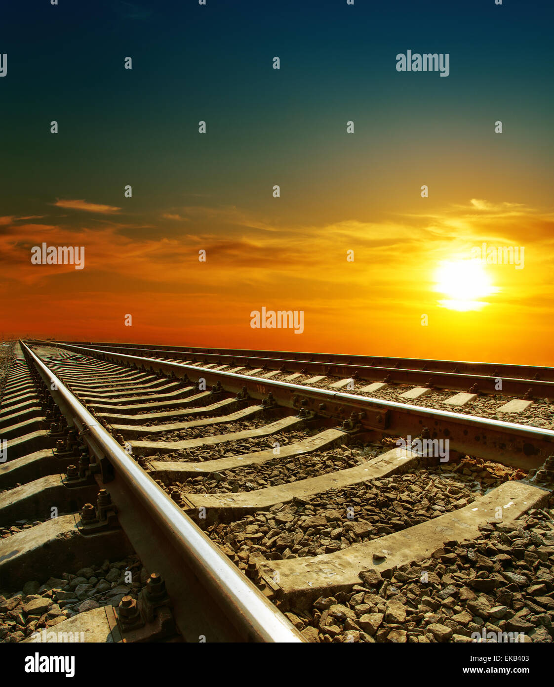 sunset over railroad Stock Photo - Alamy
