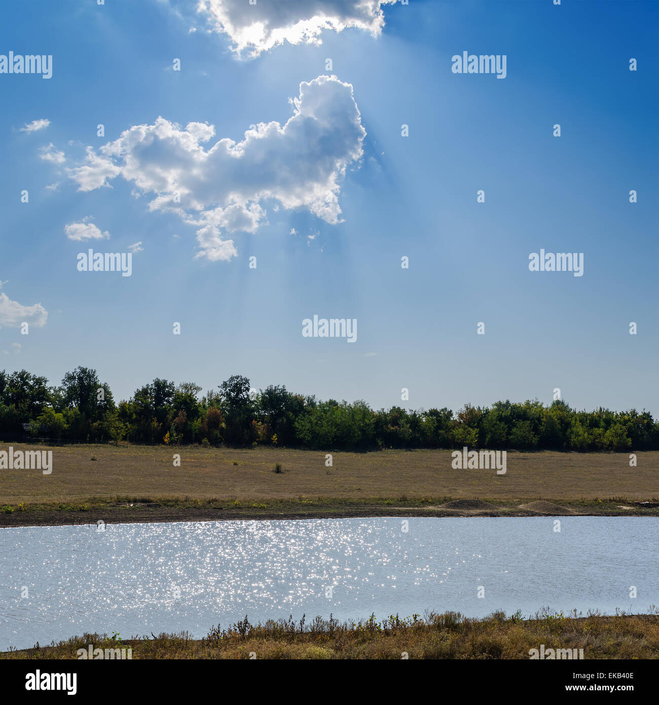river under sunny sky with clouds Stock Photo - Alamy