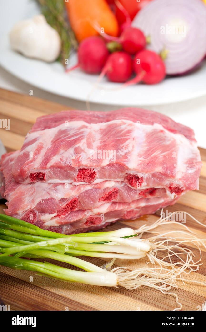 chopping fresh pork ribs and vegetables Stock Photo - Alamy