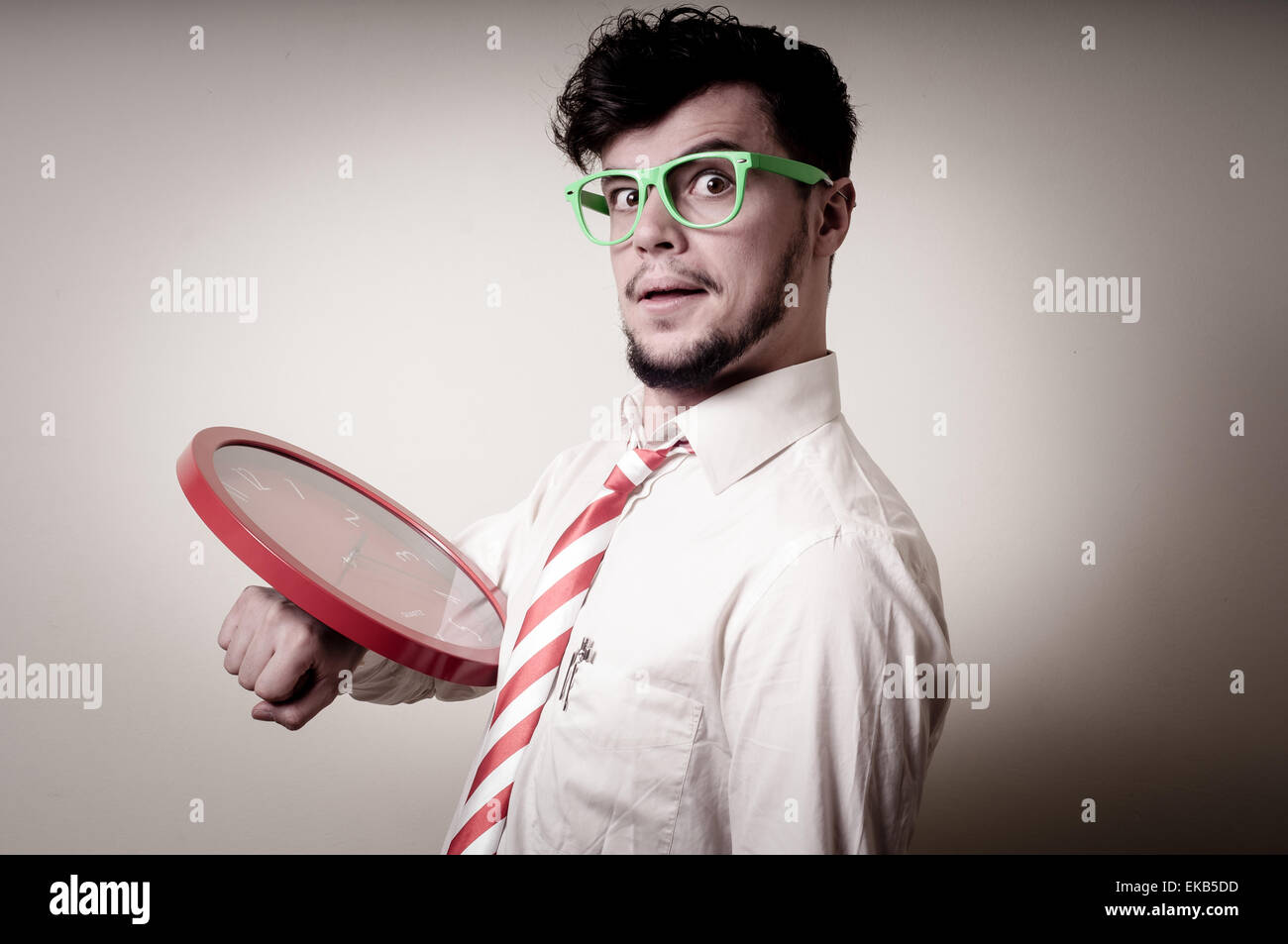 funny businessman with wall clock Stock Photo - Alamy