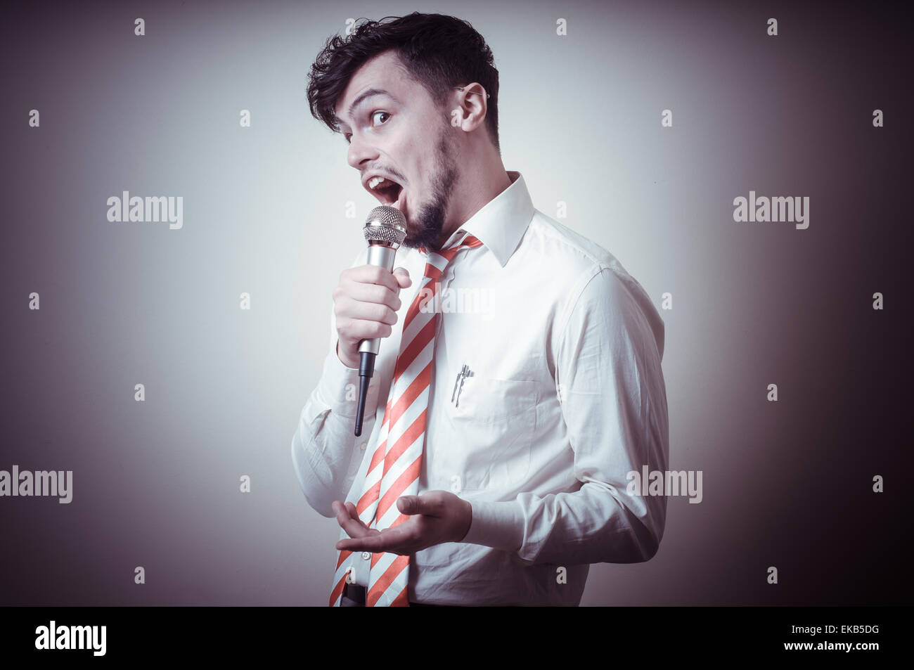 funny stylish businessman singing Stock Photo - Alamy