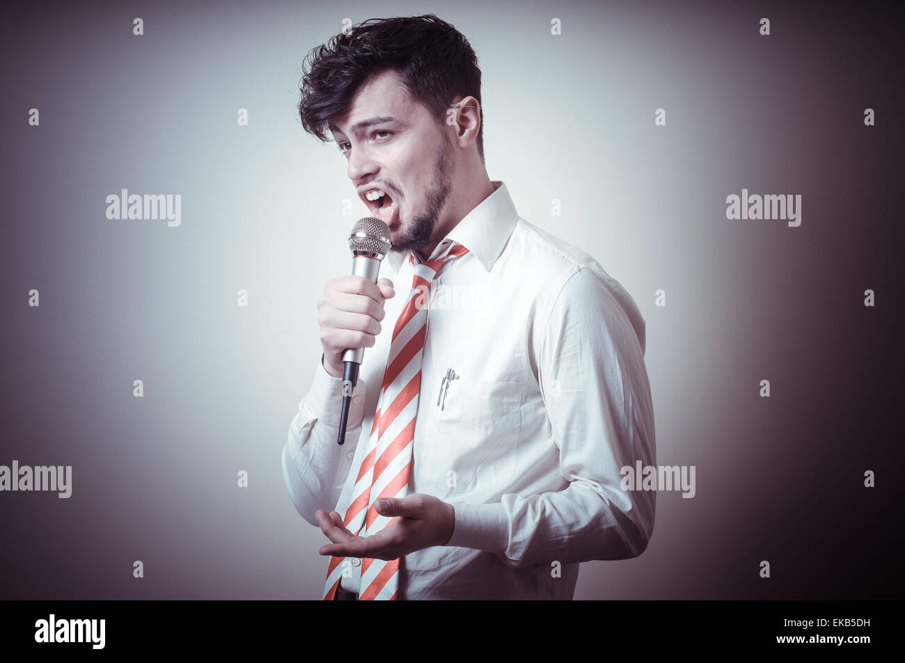 funny stylish businessman singing Stock Photo - Alamy