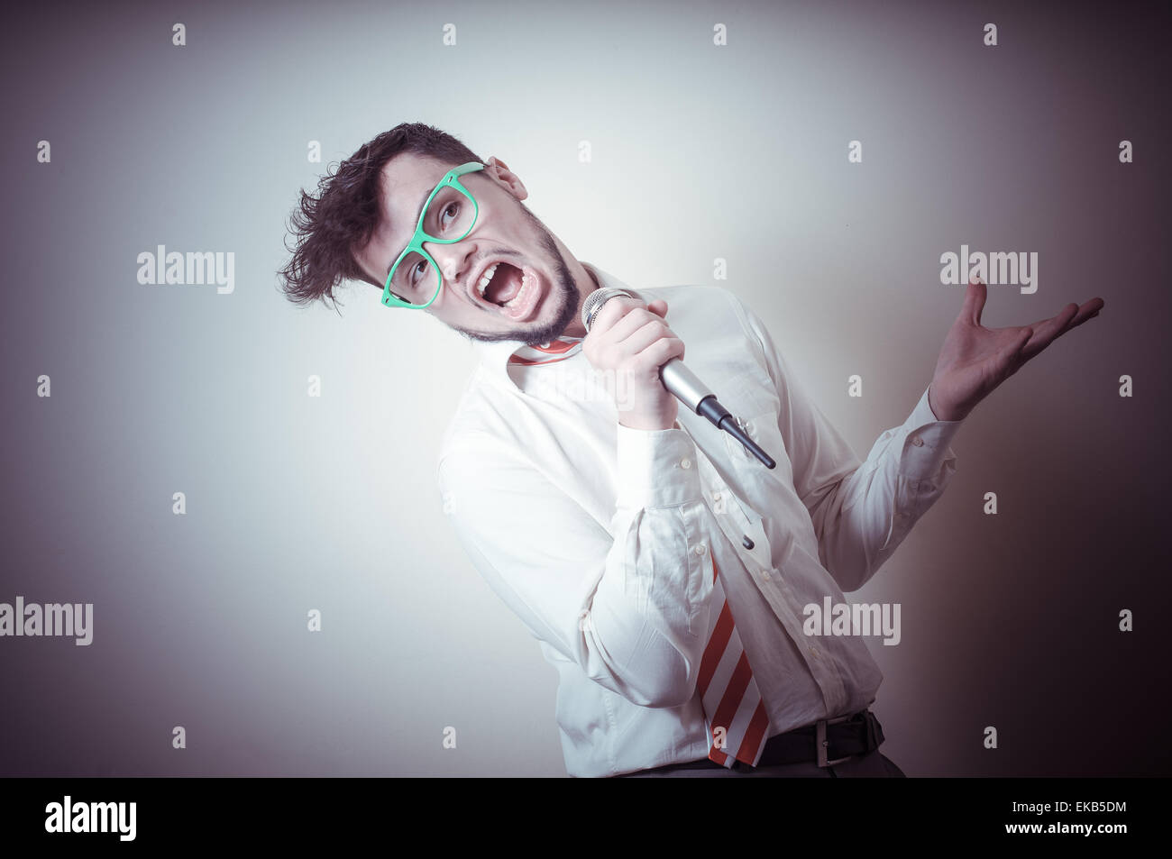 funny stylish businessman singing Stock Photo - Alamy