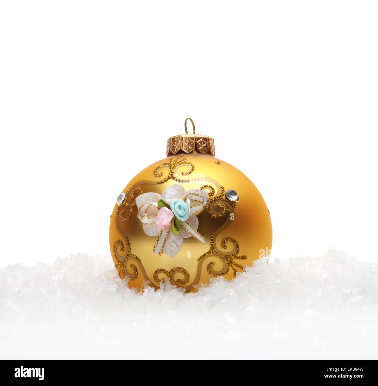 Gold Christmas balls in snow Stock Photo - Alamy