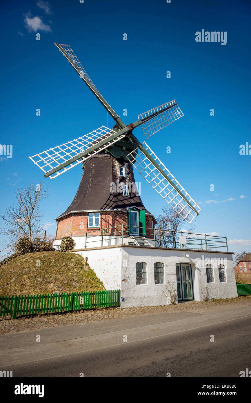 Windmill on a road Stock Photo - Alamy