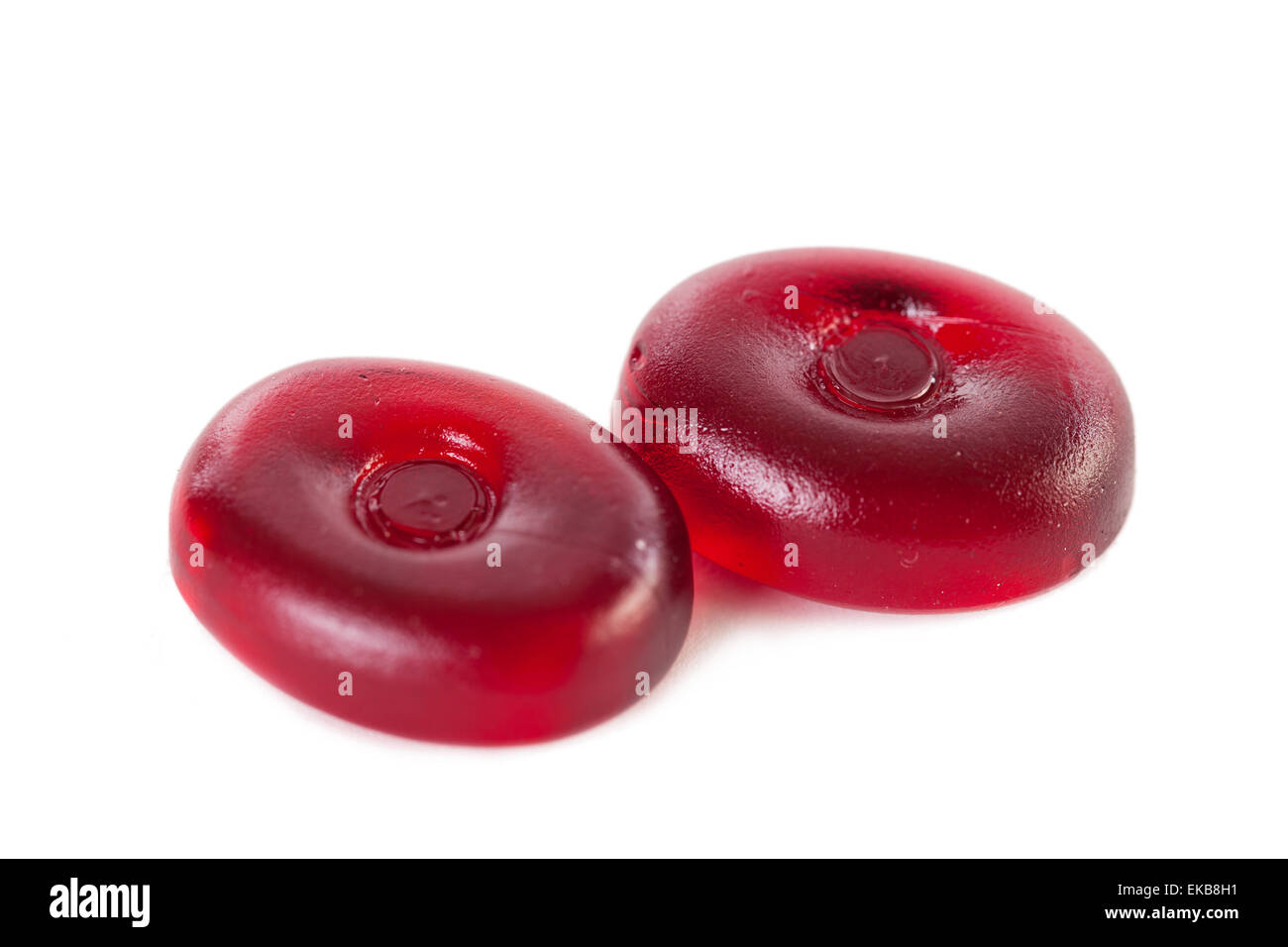Red candies isolated on a white background Stock Photo - Alamy