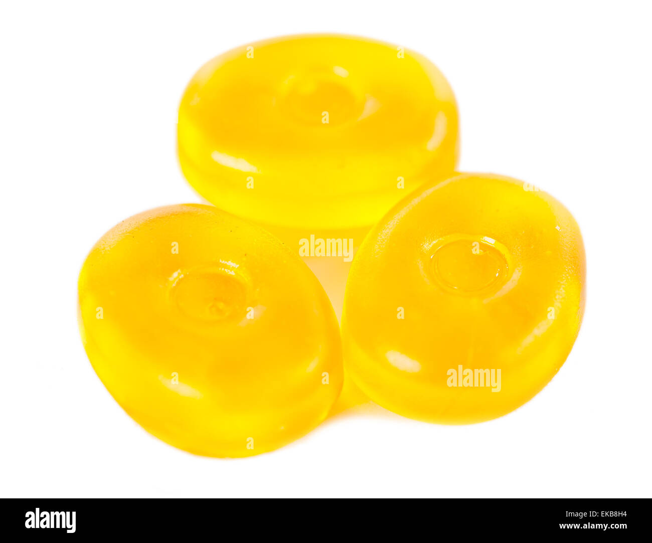Yellow candies isolated on a white background Stock Photo - Alamy