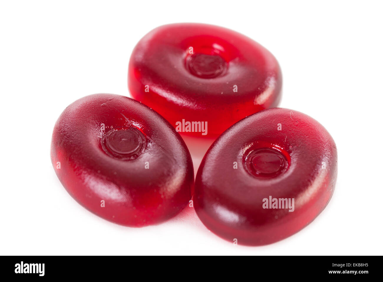 Red candies isolated on a white background Stock Photo - Alamy