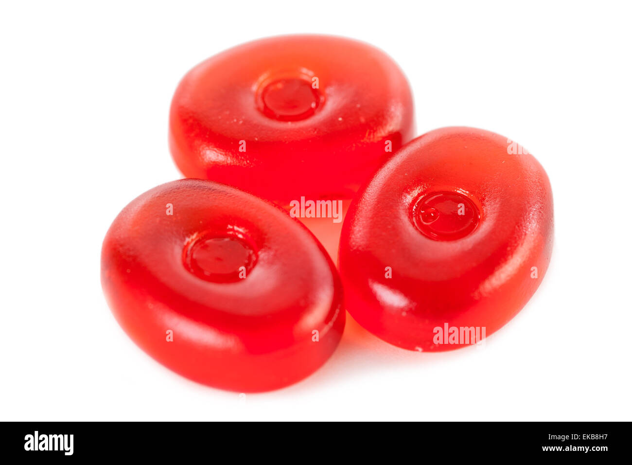 Red candies isolated on a white background Stock Photo - Alamy