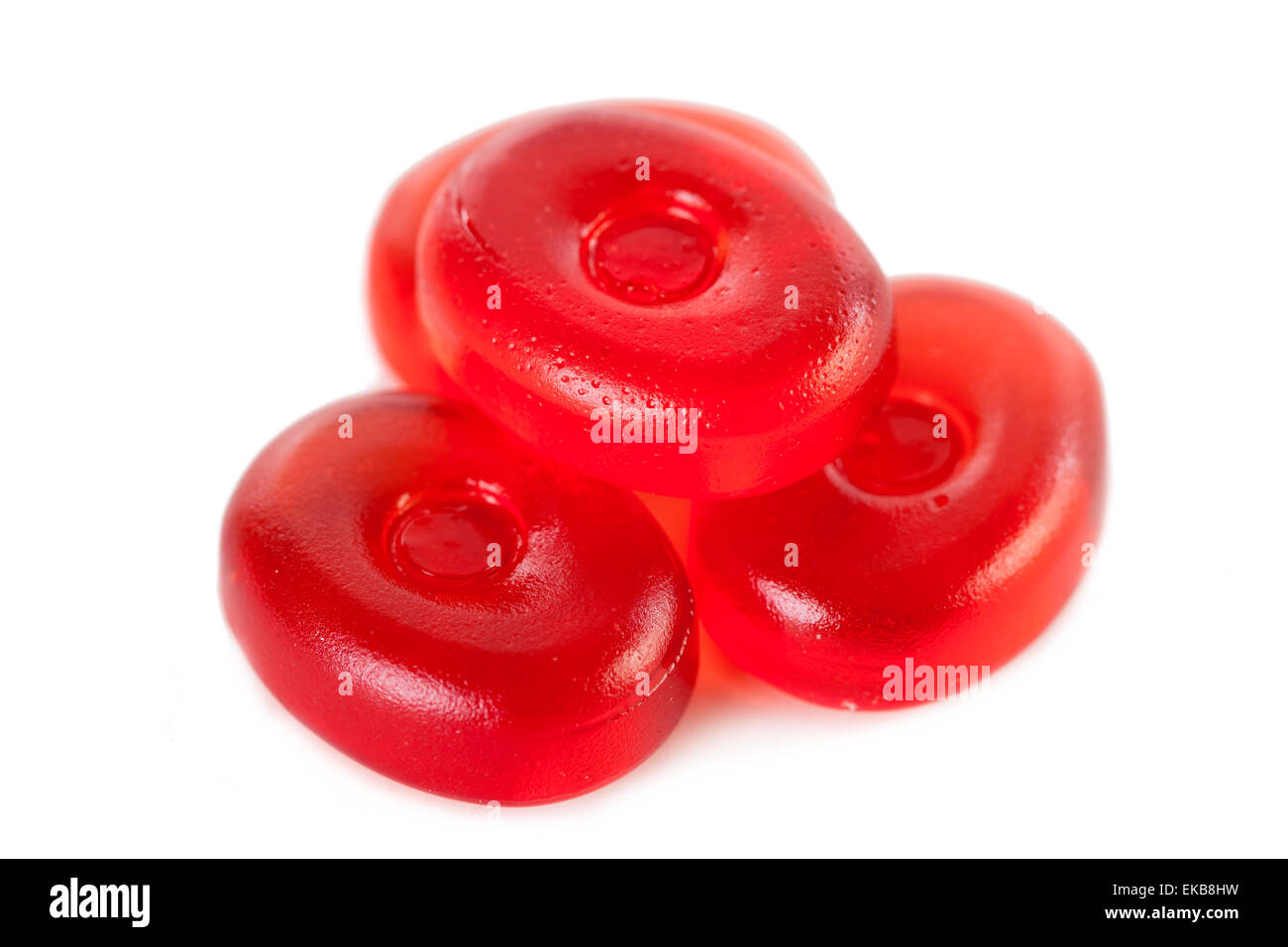 Red candies isolated on a white background Stock Photo - Alamy