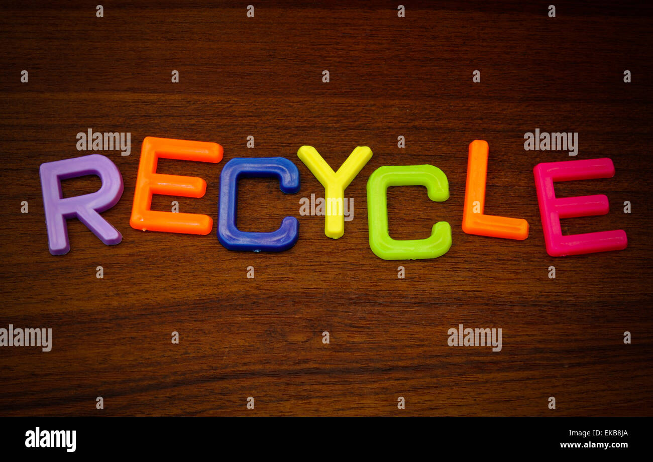 Recycle in colorful toy letters on wood background Stock Photo - Alamy