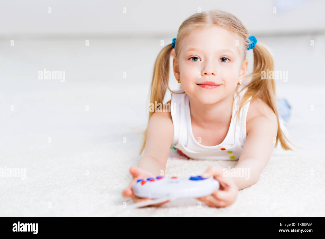 girl playing on a game console Stock Photo - Alamy
