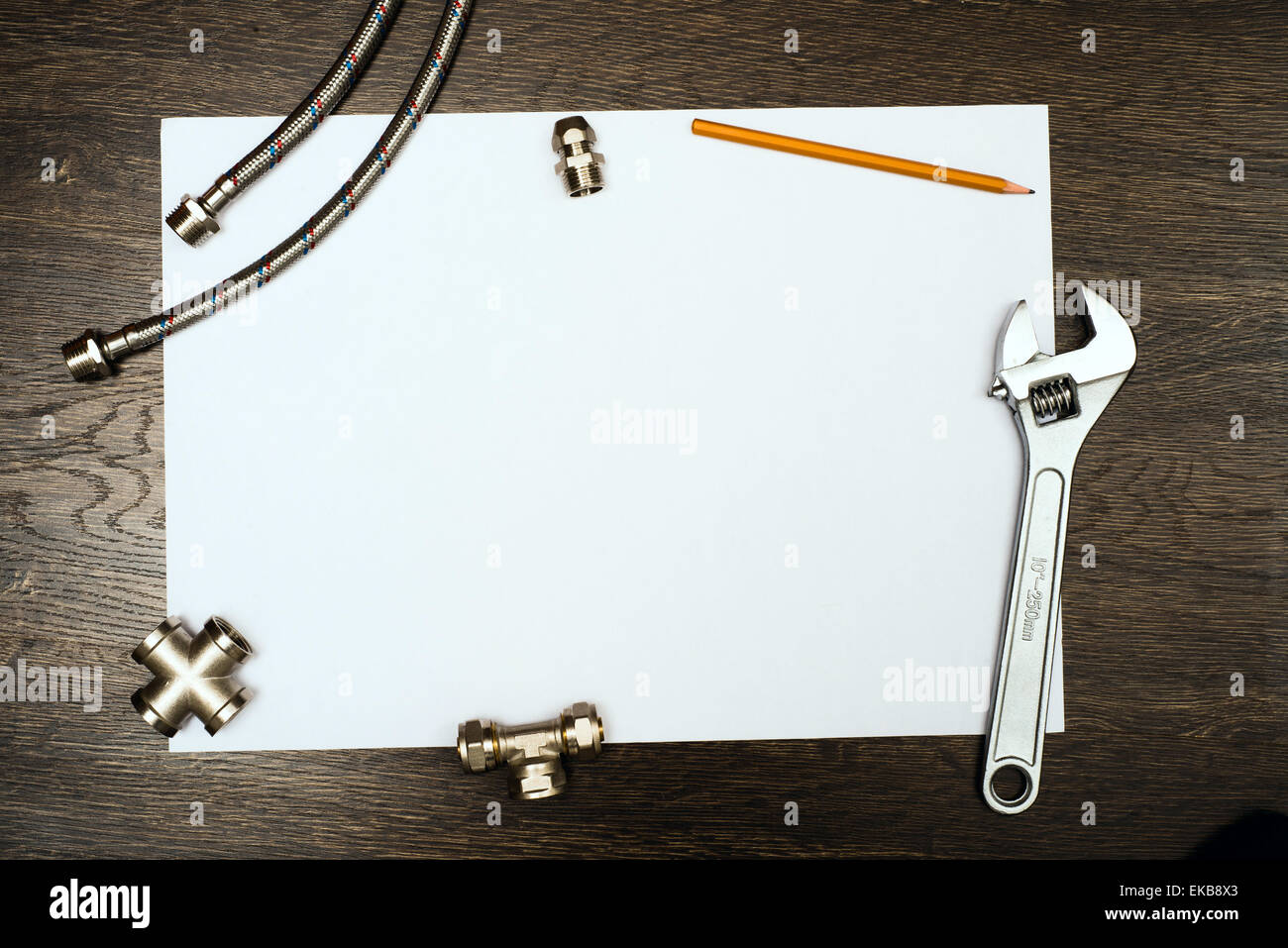 plumbing tools on a white sheet of paper Stock Photo - Alamy