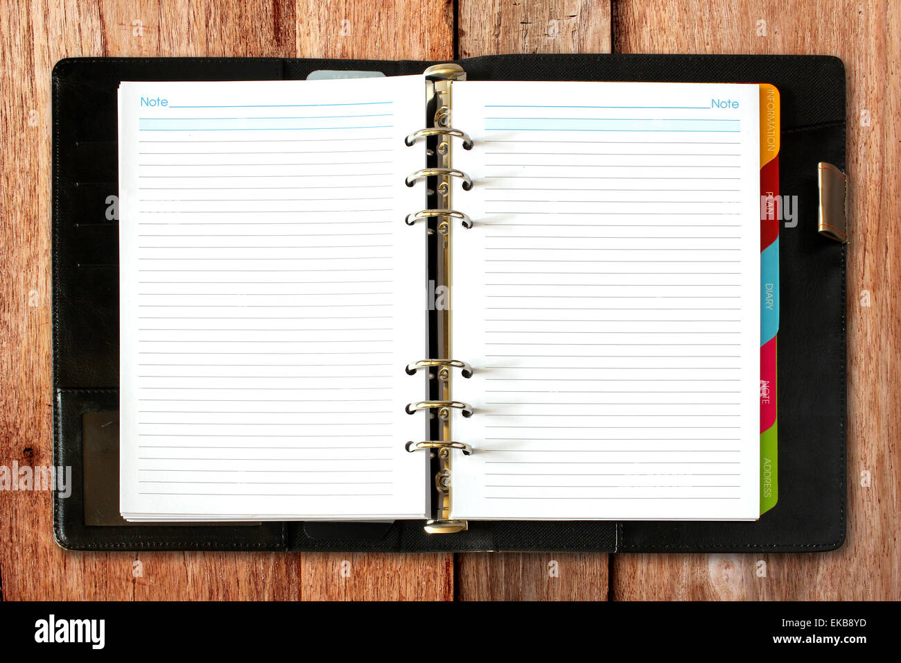 leather open notebook on old wooden background Stock Photo - Alamy