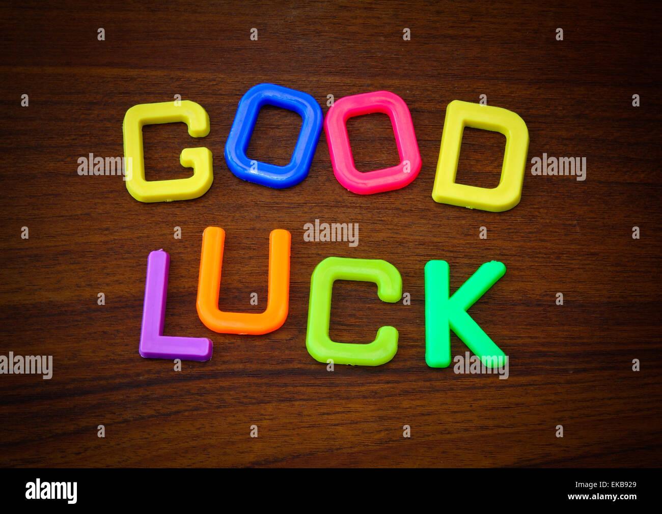 Good luck in colorful toy letters on wood background Stock Photo - Alamy