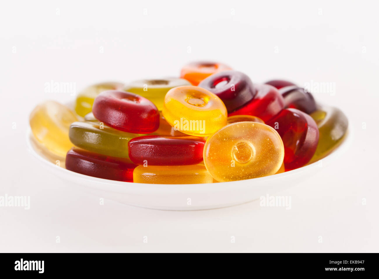 Bright candies isolated on a white background Stock Photo - Alamy