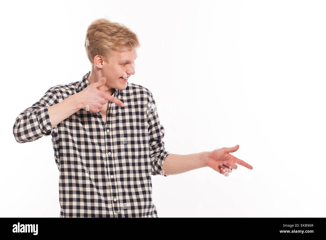 Young handsome guy showing on something Stock Photo - Alamy