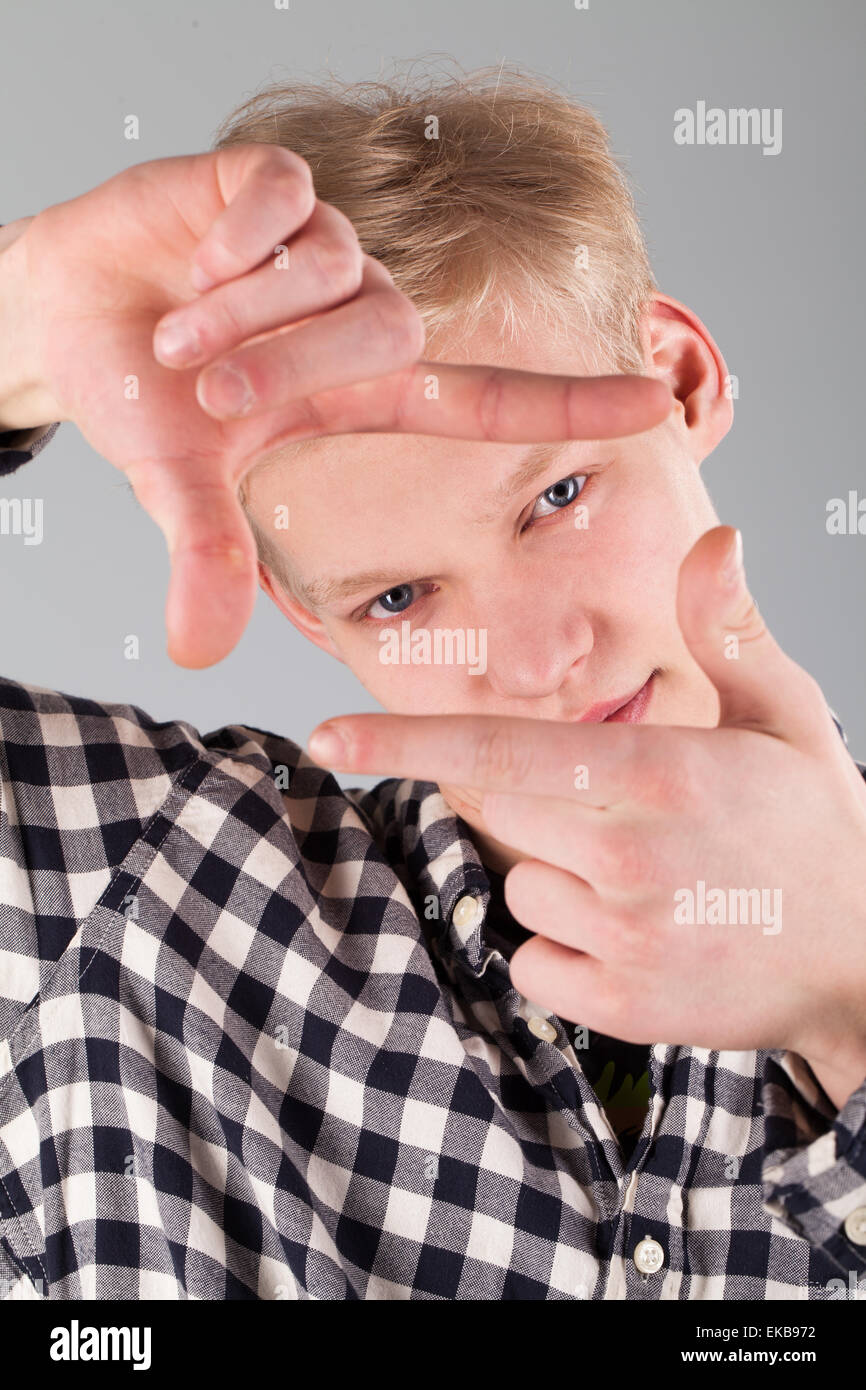 Portrait of young handsome guy making a photo Stock Photo - Alamy
