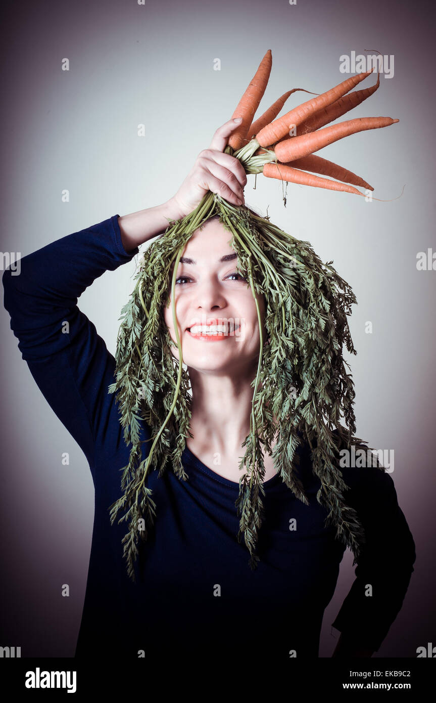 beautiful woman with carrots on hair Stock Photo - Alamy