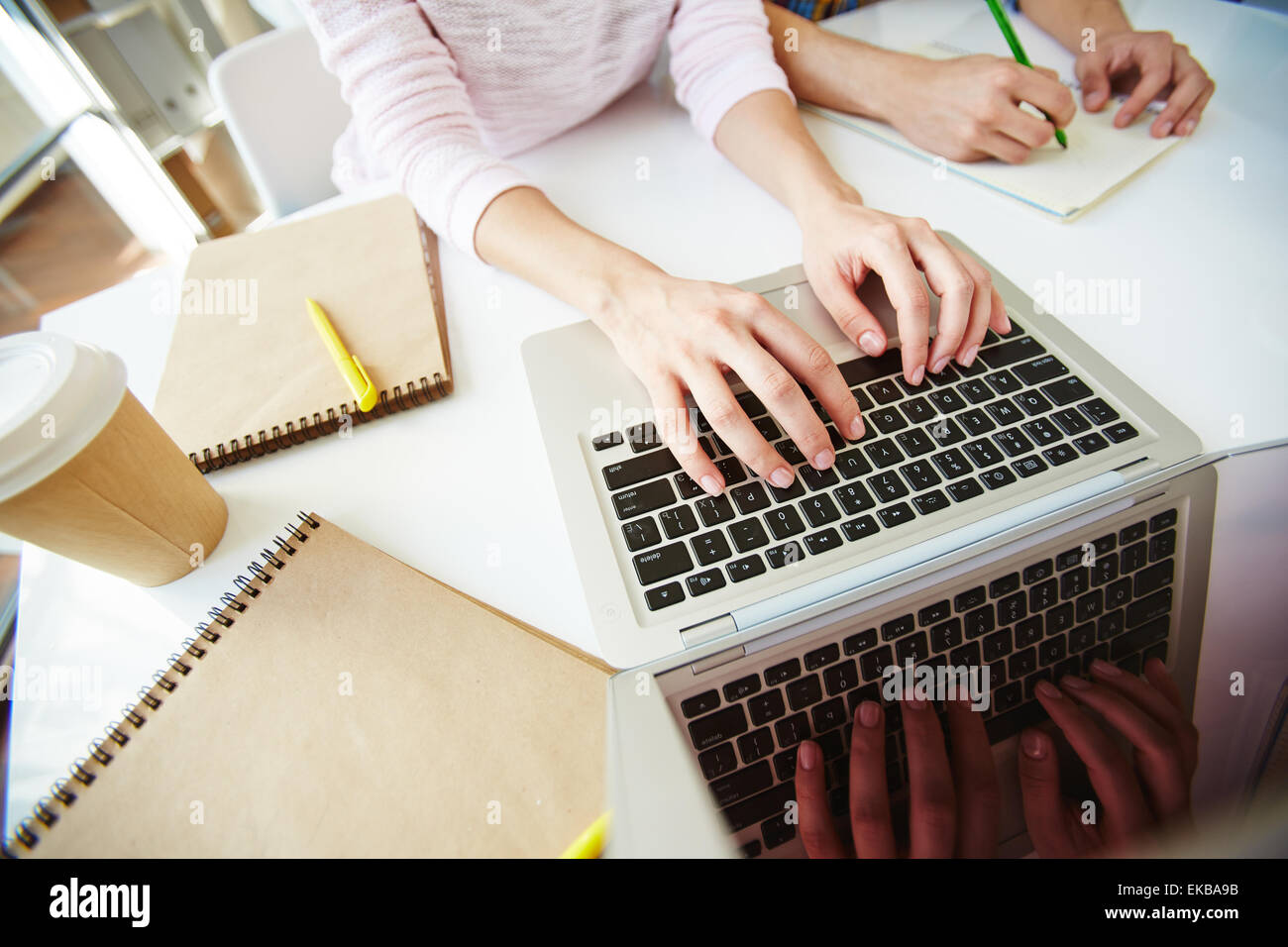 Female student typing on laptop at workplace Stock Photo - Alamy