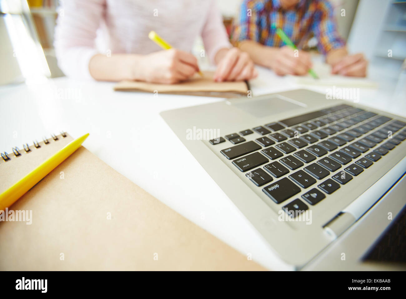Laptop keypad and notepad with pen at workplace Stock Photo - Alamy