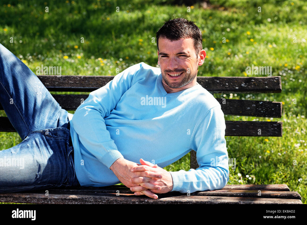 relaxed on a bench Stock Photo - Alamy