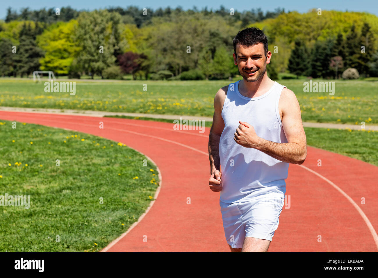 man running on a track Stock Photo - Alamy