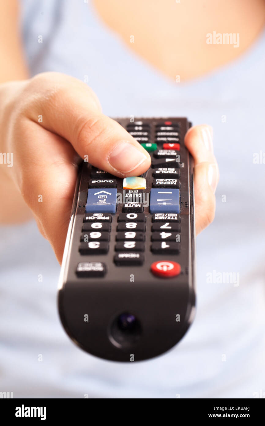 TV console in woman's hand Stock Photo - Alamy