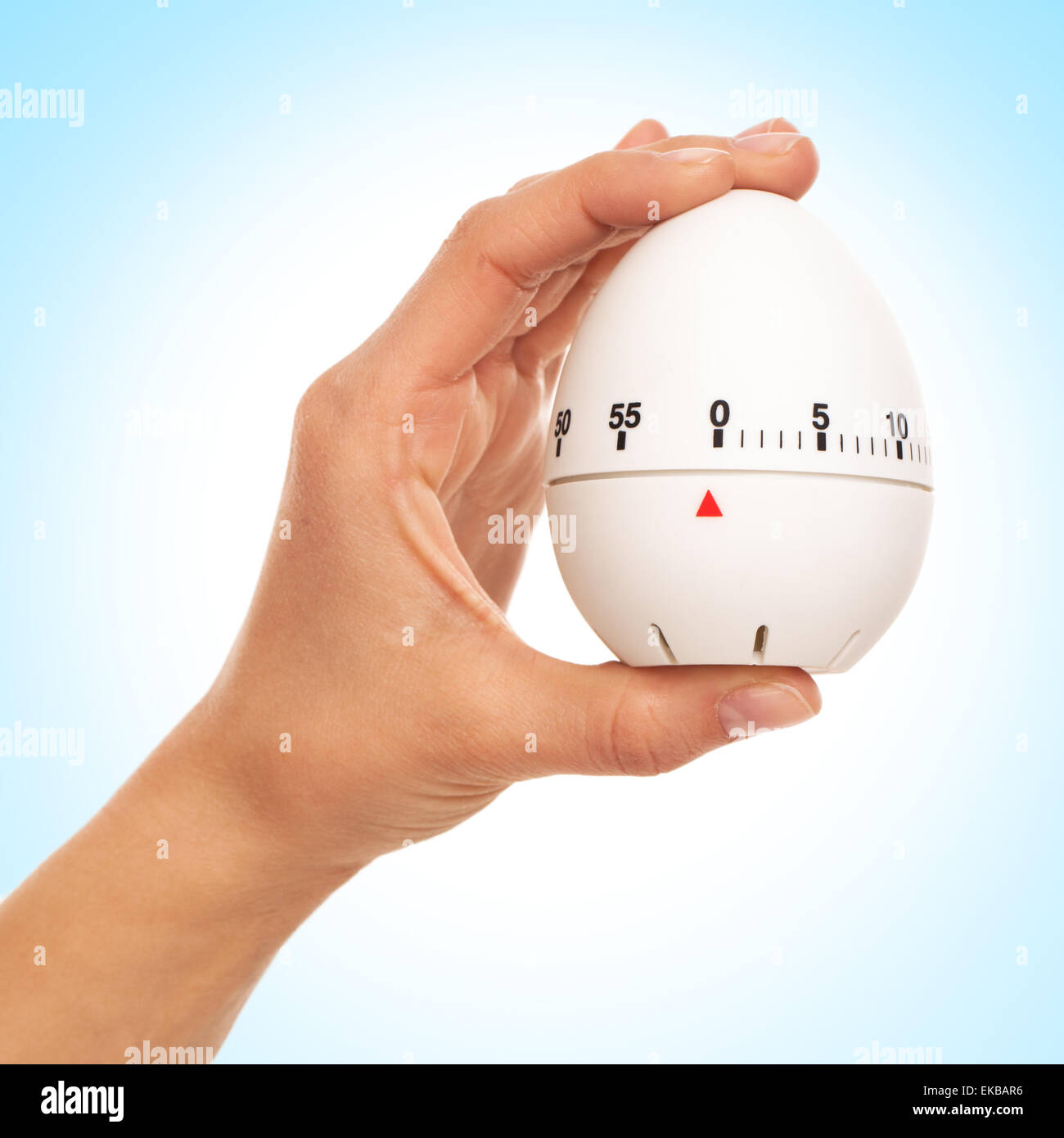 Kitchen timer in woman's hand Stock Photo - Alamy