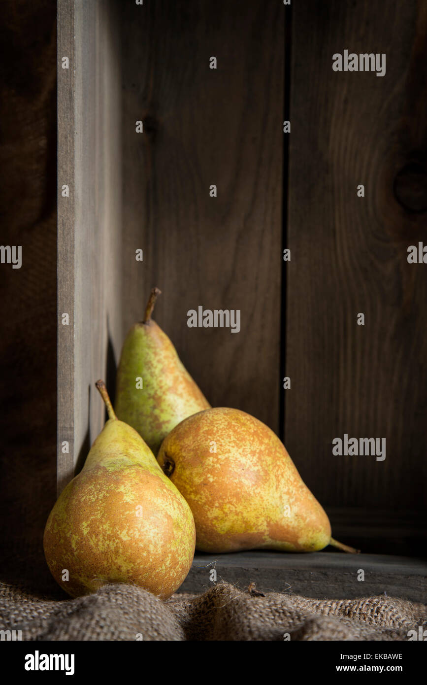 Pears in rustic setting with wooden box and hessian sack Stock Photo ...