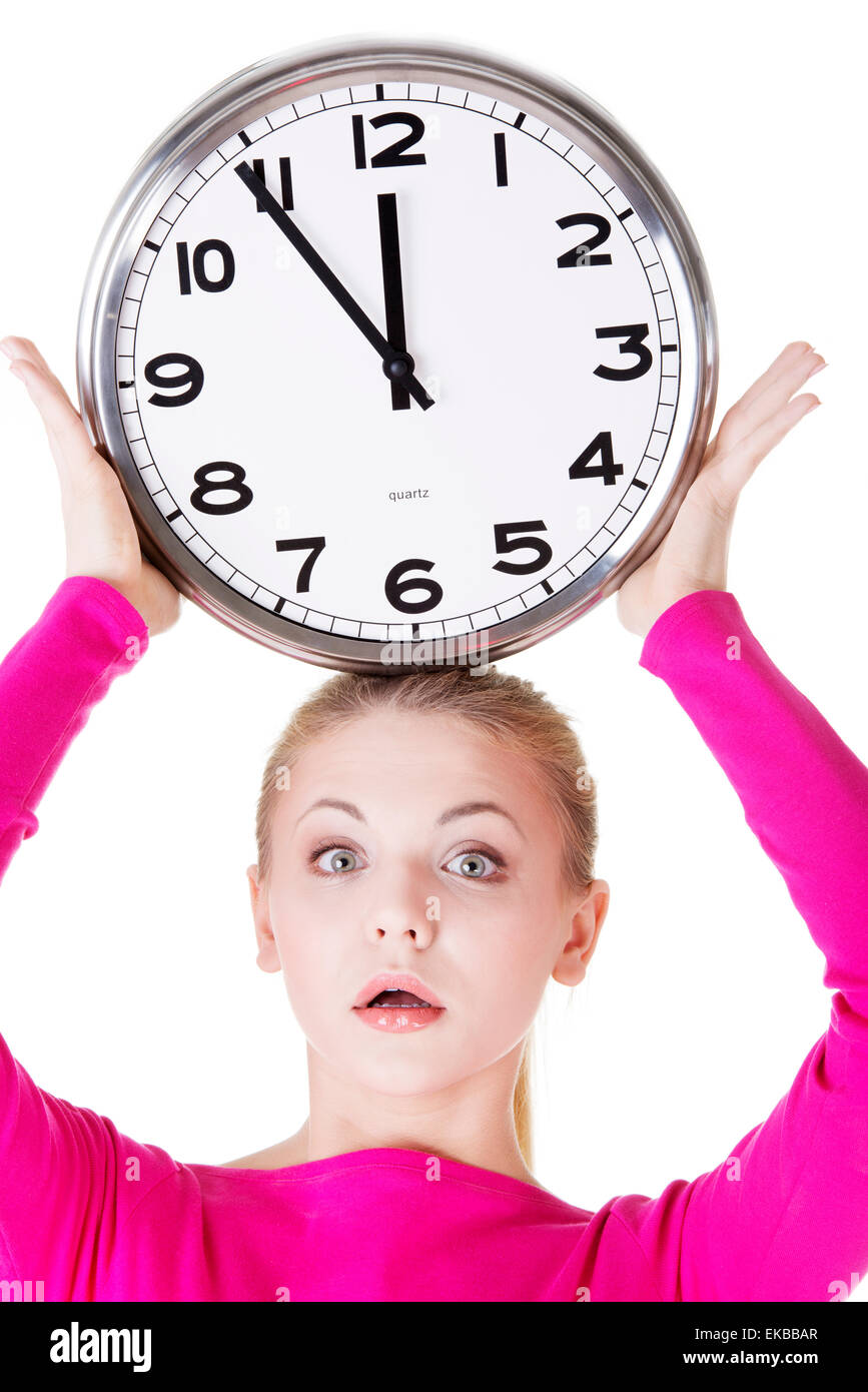 Shocked woman with clock Stock Photo - Alamy