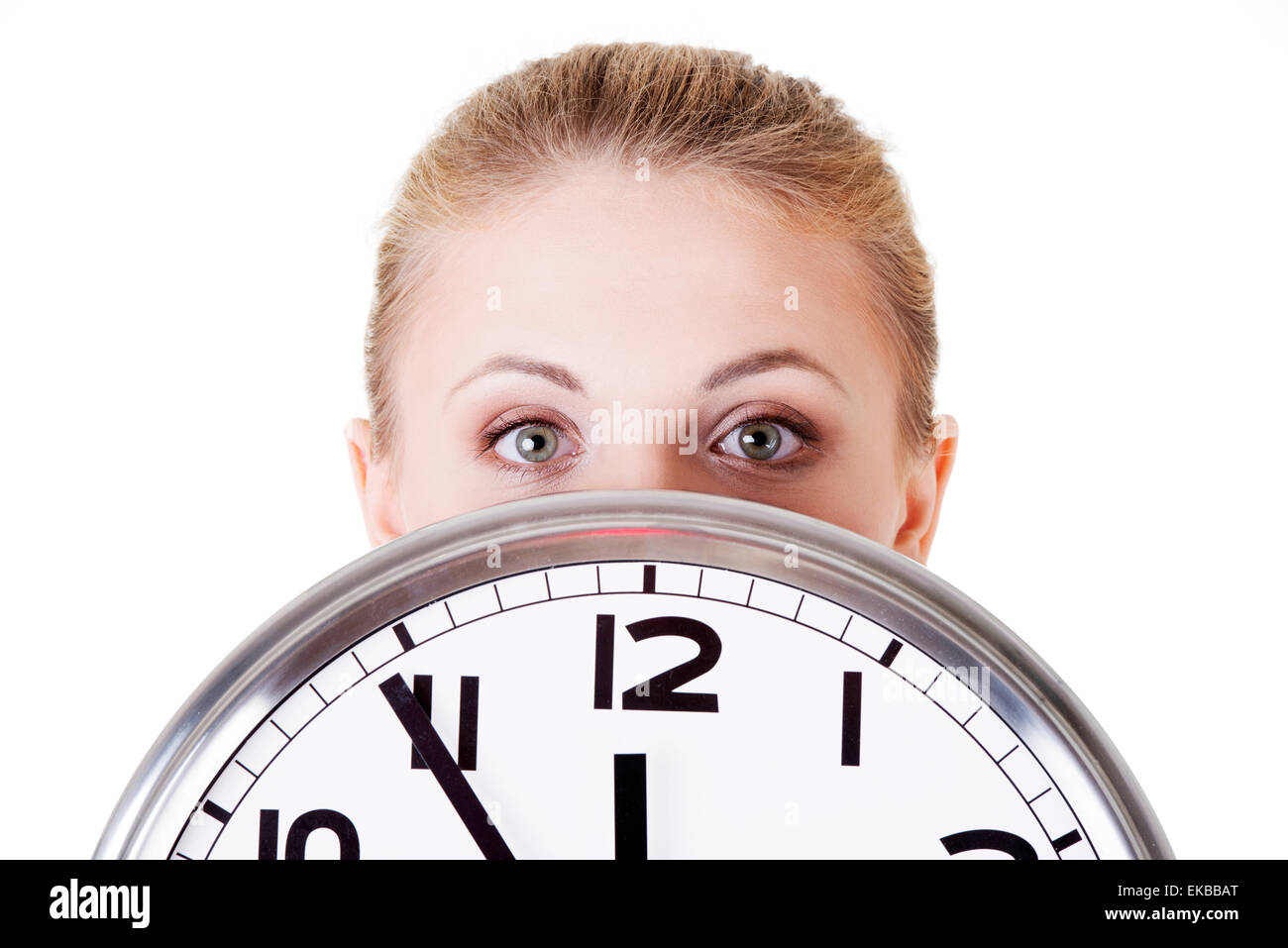 Shocked woman with clock Stock Photo - Alamy