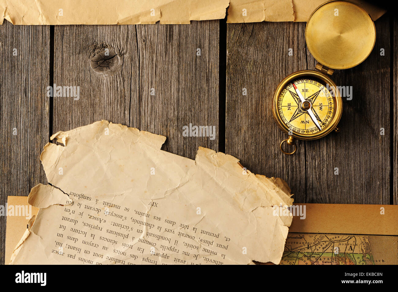 Antique compass over old map Stock Photo - Alamy