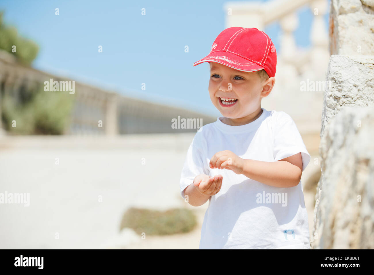 Portrait of cute boy in a red cap Stock Photo - Alamy