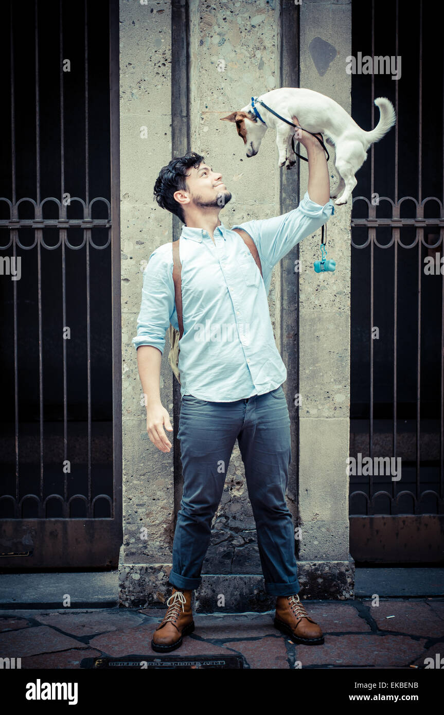 stylish man in the street with a jack russel Stock Photo - Alamy