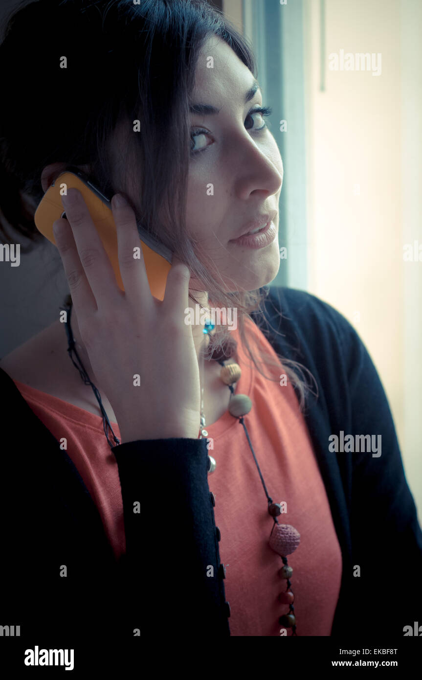 beautiful woman at home at the phone Stock Photo - Alamy