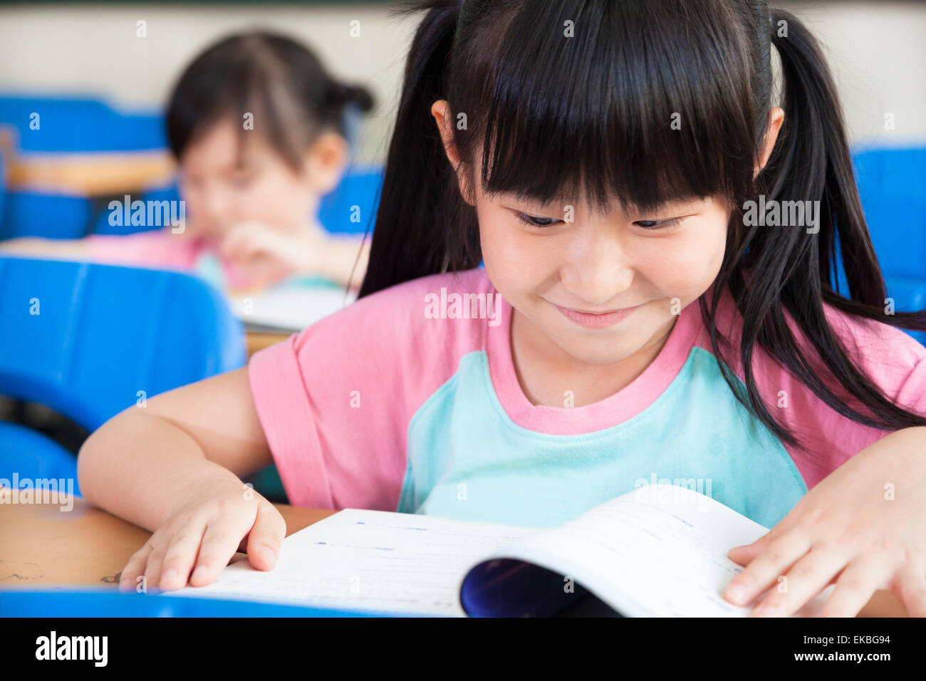 happy little girls study in classroom Stock Photo - Alamy
