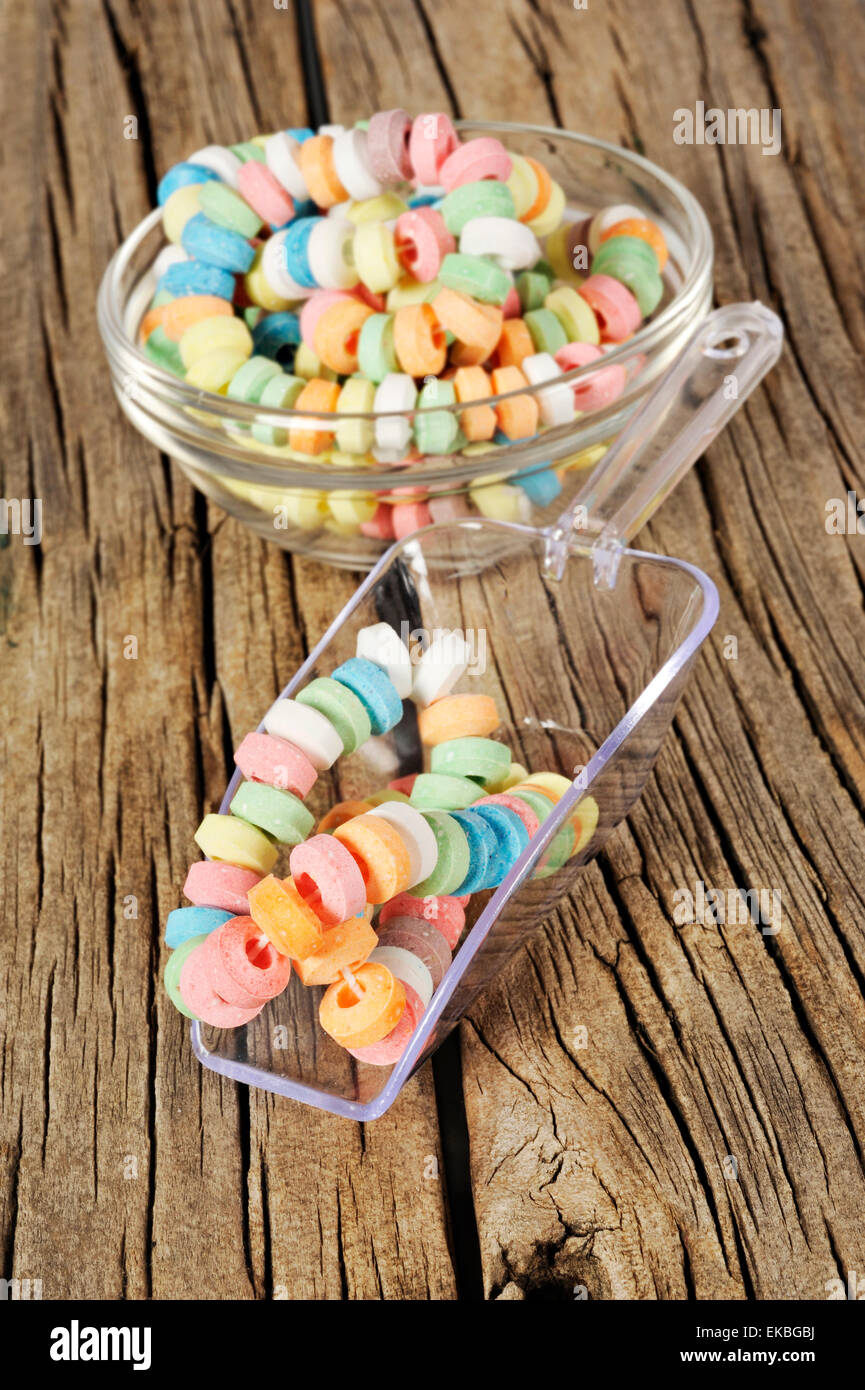 Candy on strings on wooden background Stock Photo - Alamy