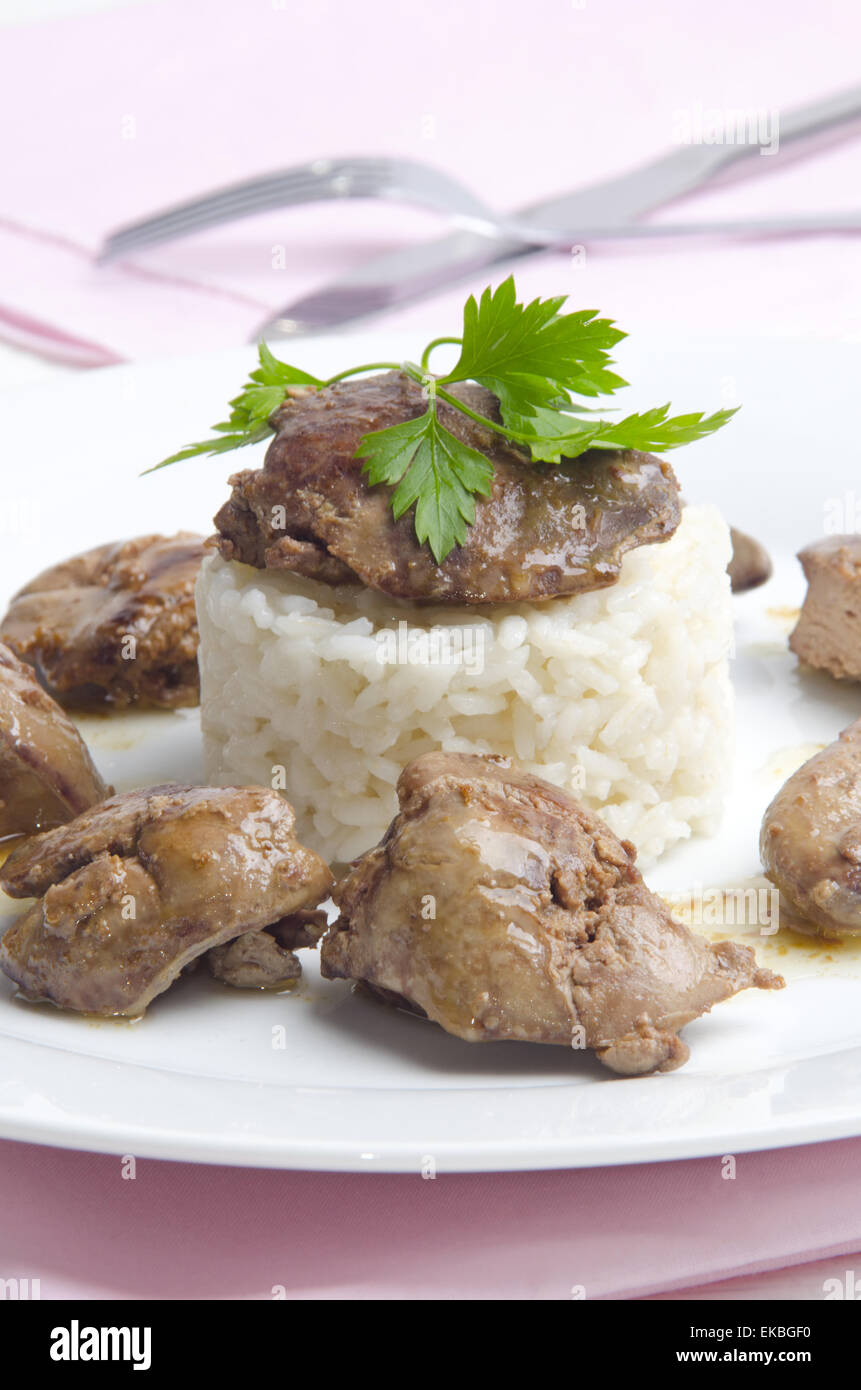 chicken liver on rice with parsley Stock Photo - Alamy