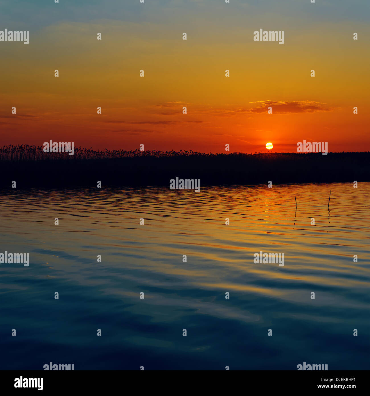red sunset over river Stock Photo - Alamy