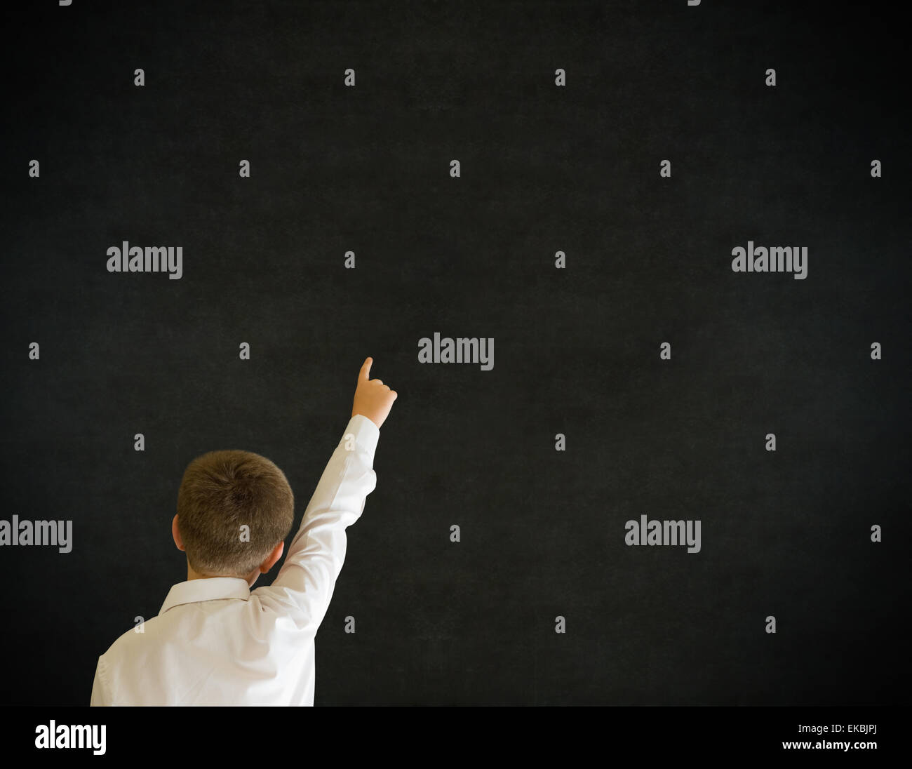 School boy hands up answering question Stock Photo - Alamy