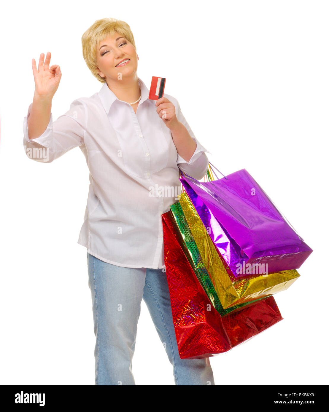 Senior woman with bags and credit card Stock Photo - Alamy