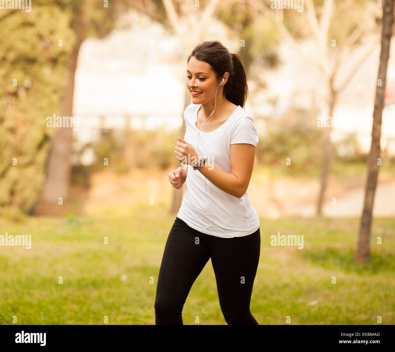young beautiful woman jogging Stock Photo - Alamy