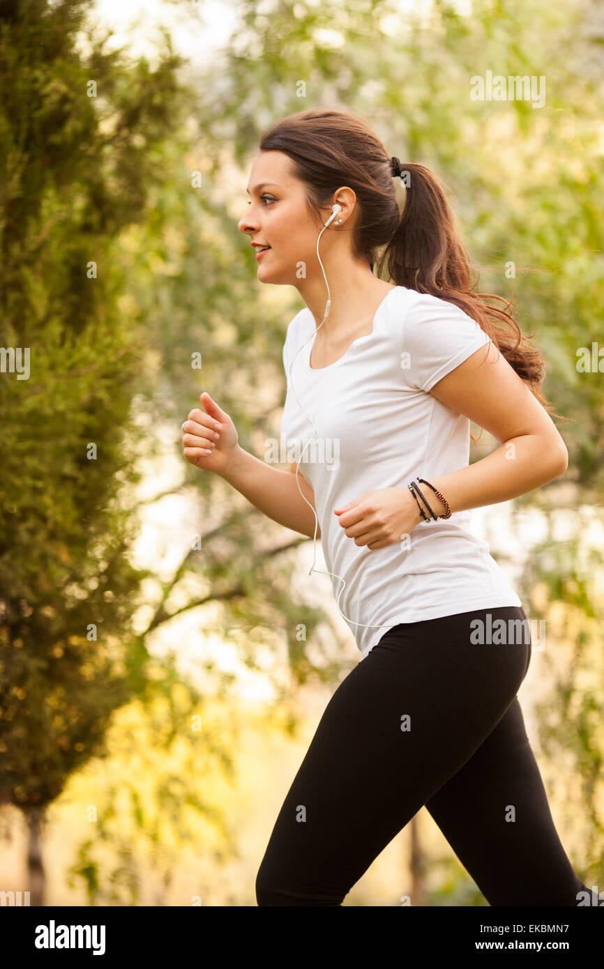 young beautiful woman jogging Stock Photo - Alamy