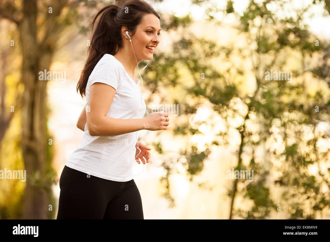 young beautiful woman jogging Stock Photo - Alamy